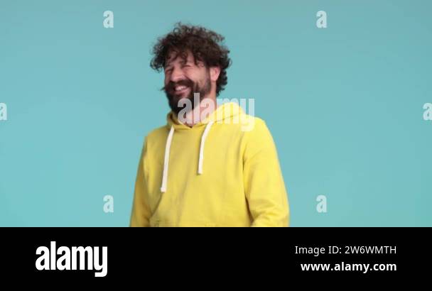 funny cool guy with curly hair and long beard having fun, making jokes ...