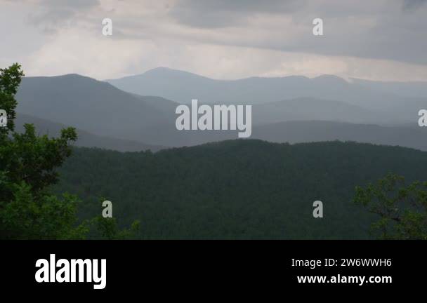 storm is coming - dramatic rain clouds approach the hill. a beautiful ...
