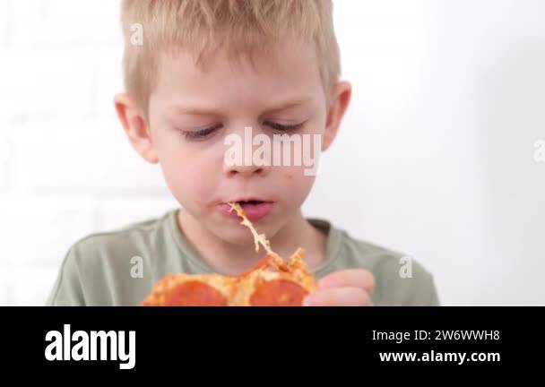 Portrait blonde boy Eating cheese Pizza Smiling close up .Happy Child ...