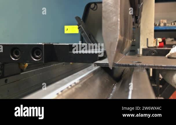 The process of metal bending on a CNC bending machine. Bending of metal ...