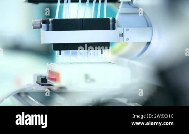 Automation in the clinical laboratory. Pipetting robot laboratory. Medicine robotics. Research ...