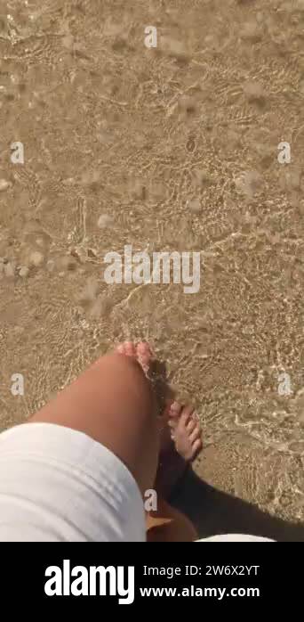 point of view woman legs walking barefoot by sea beach Stock Video ...
