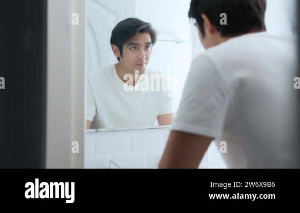Health concept of 4k Resolution. Asian man washing his face with water ...
