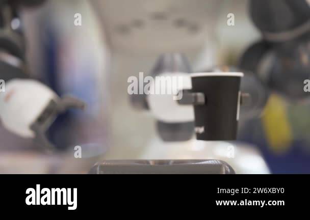 Motion of robotic arm making coffee. Robotic arm takes paper coffee ...