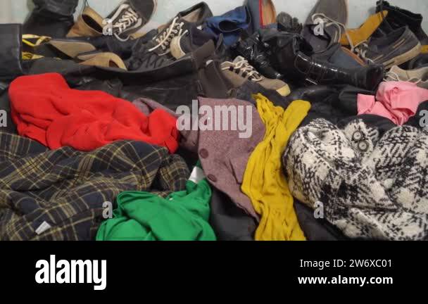 Clothes and shoes waste recycle. Pile of old used clothes. Fashion ...