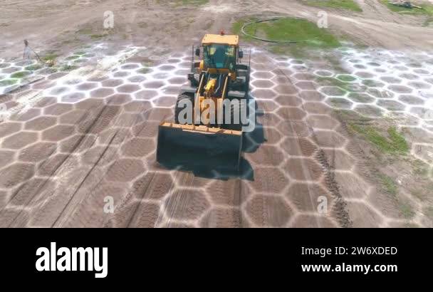 The bulldozer levels the floor plane for future work. The bulldozer ...