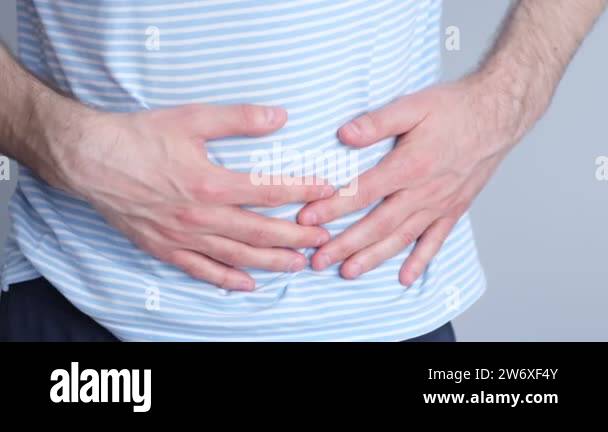 Man experiencing stomach pain. Man with abdominal pain health problem ...