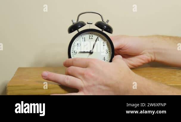 Adjusting clock back by one hour, dst end Stock Video Footage - Alamy