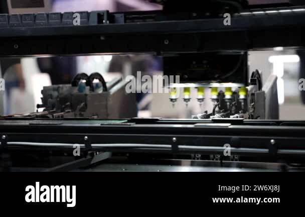 Factory machine at work the circuit board is assembled using an ...