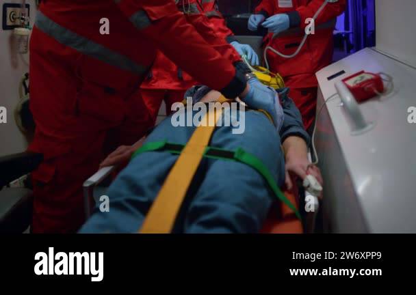 Paramedics examining patient on ambulance Stock Videos & Footage - HD ...