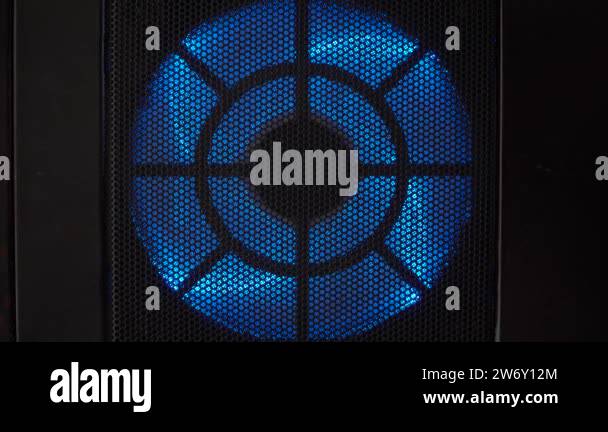 Perforated wall of a PC case with 120mm blue ventilator behind it. Fans ...