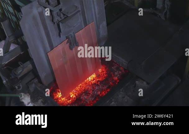 The furnace with molten metal, the melting of copper in the furnace ...