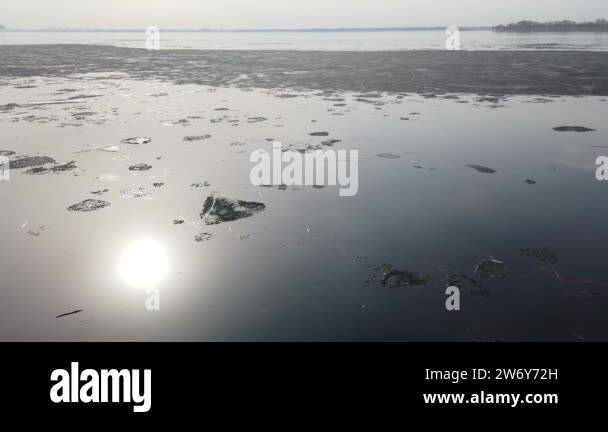 Melting ice flowing on water surface. Ice drift on the river. Global ...