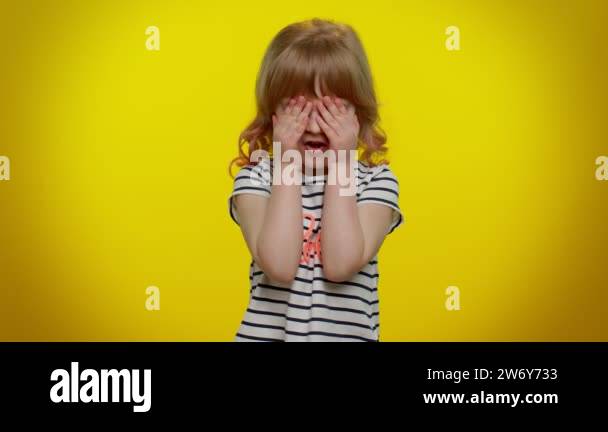 Little teen child kid girl closing eyes with hand showing stop gesture ...