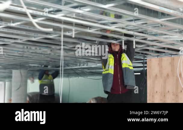 Suspended ceiling installation builder Stock Videos & Footage - HD and ...