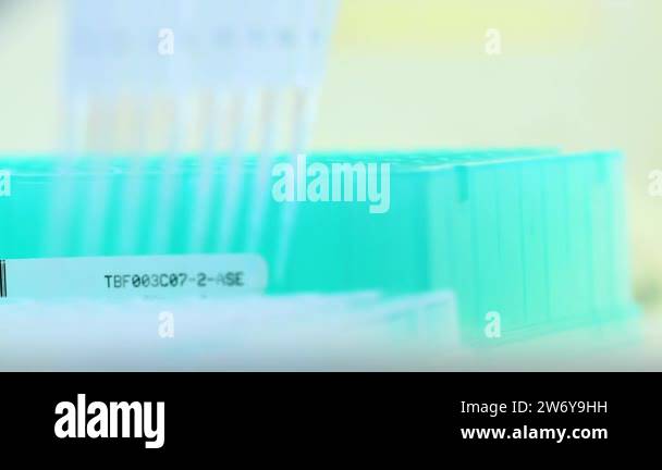 Lab machine making tests in a white lab. Samples tubes and a ...