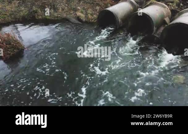Flying over concrete sewers. Streams of water flow through concrete ...