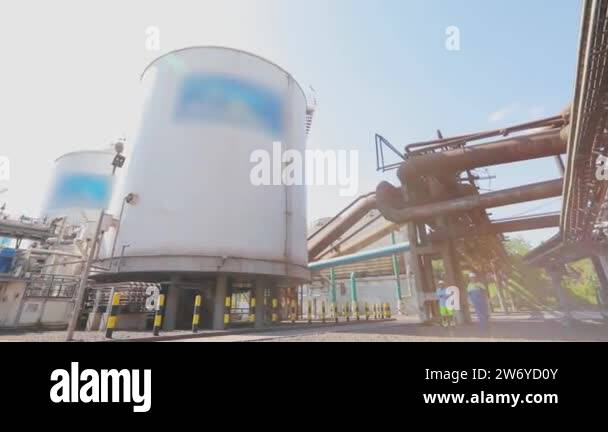 Large storage tanks in the factory. Exterior of a modern factory. White ...