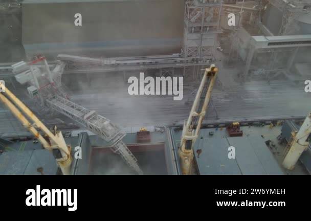 4K modern industrial port with containers from top or bird's eye view ...