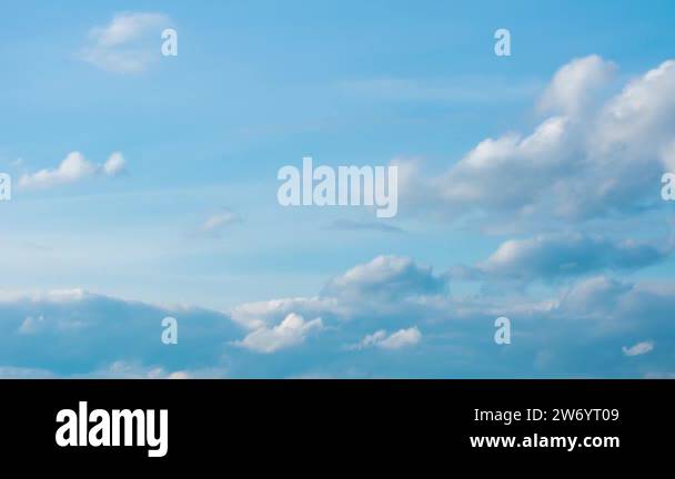 Fluffy cumulus clouds moving fast in time-lapse. Daylight, cloudy ...