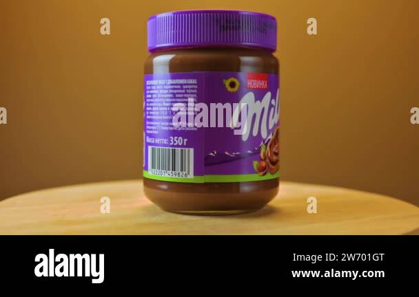 jar of new milka chocolate paste with hazelnuts on a beautiful ...