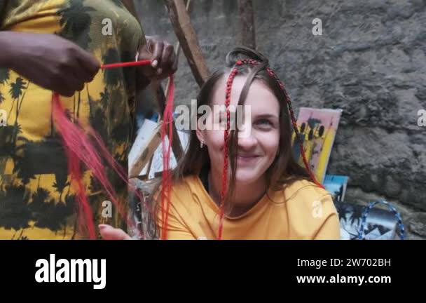 Process of Weaving African Braids with Red Kanekalon Outdoor, Zanzibar ...