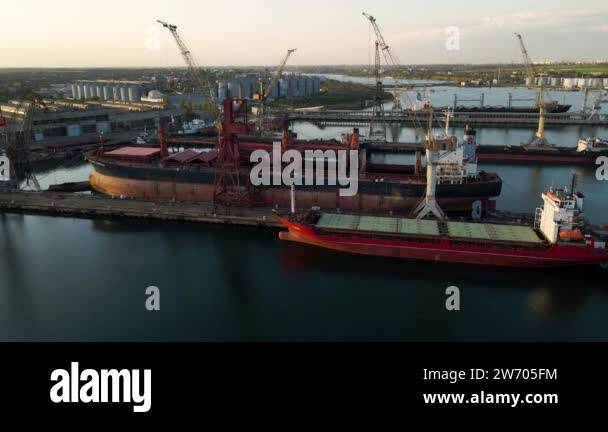 4K modern industrial port with containers from top or bird's eye view ...
