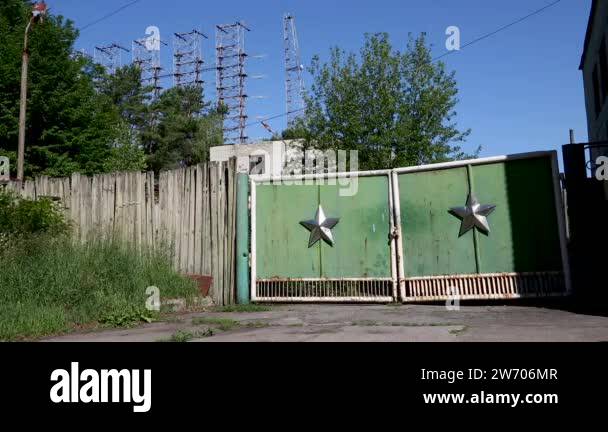 Green gate with Soviet stars. Secret military facility in Chernobyl ...