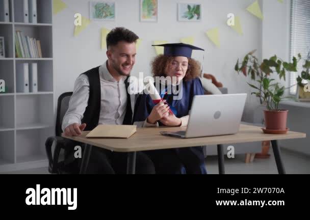 happy married couple celebrating their graduation online and receiving ...