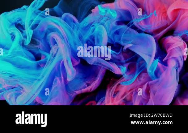 Magic mixing of color. Cloud of silky ink in water isolated on black ...