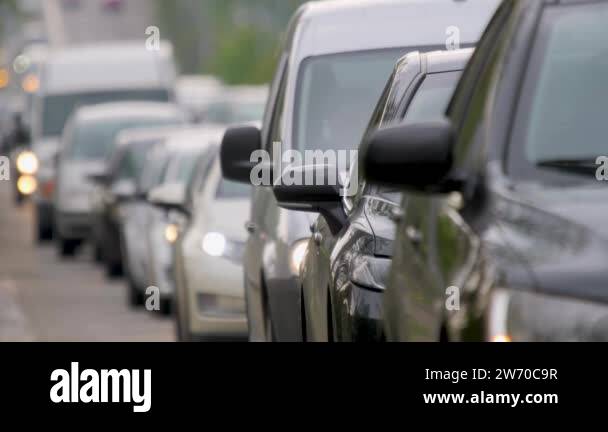 Many car moving slowly on road city traffic. Congestion street cars ...