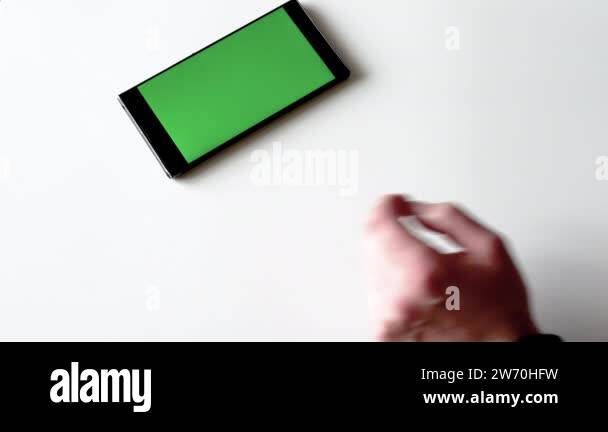 Smartphone with a green screen chroma key, swipe right on the display ...