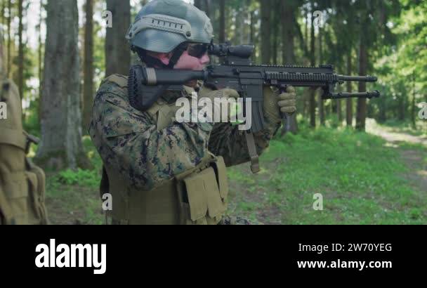 Soldiers protecting their line in dense forest. The military action of ...