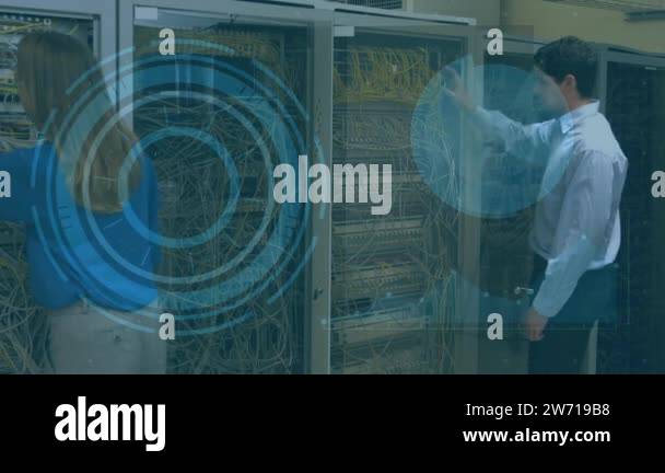 Animation of scopes scanning on screen over man and woman checking computer servers. global ...