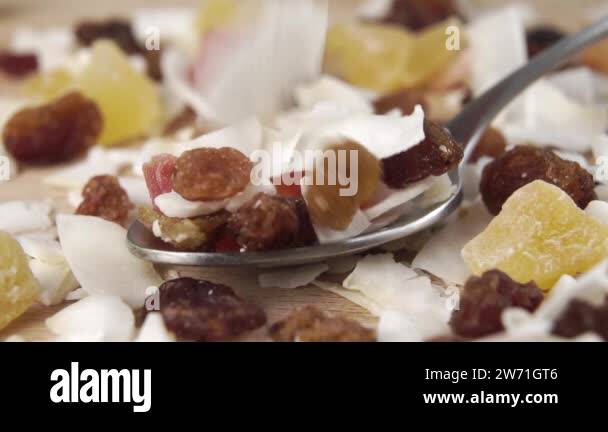 Dried pieces of tropical fruit papaya pineapple coconut and raisins ...