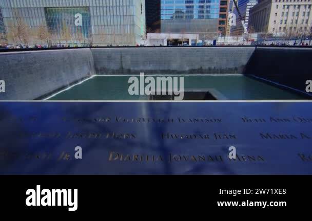 Victims names written on the memorial pool in 9/11 Park in New York ...