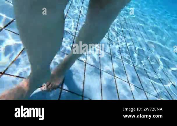female feet walk along the bottom of the pool, swim in the pool Stock ...