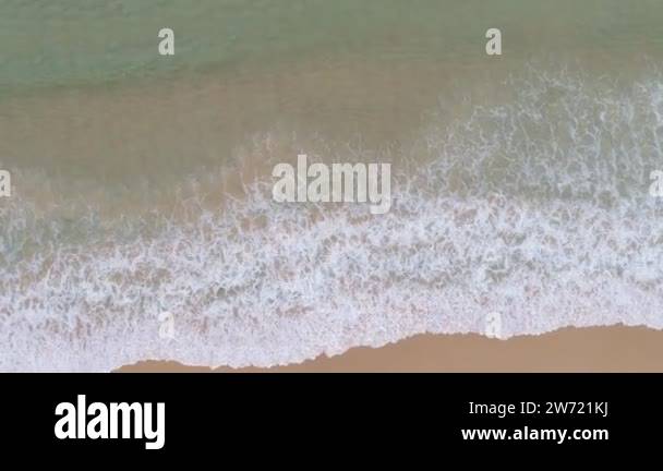 Aerial view top view Beautiful tropical beach with white wave crashing ...