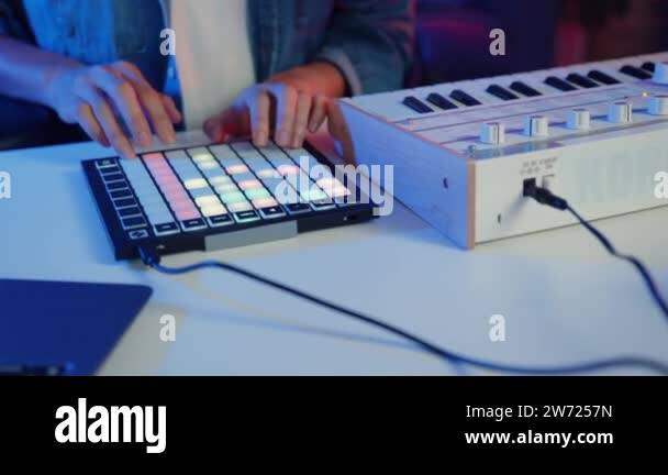 Close-up happy asia girl dj use launchpad synthesizer keyboard sound ...