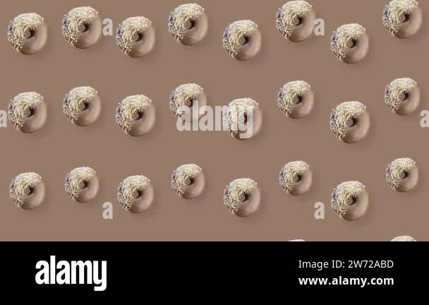 Colorful pattern of chocolate donuts isolated on brown background with ...