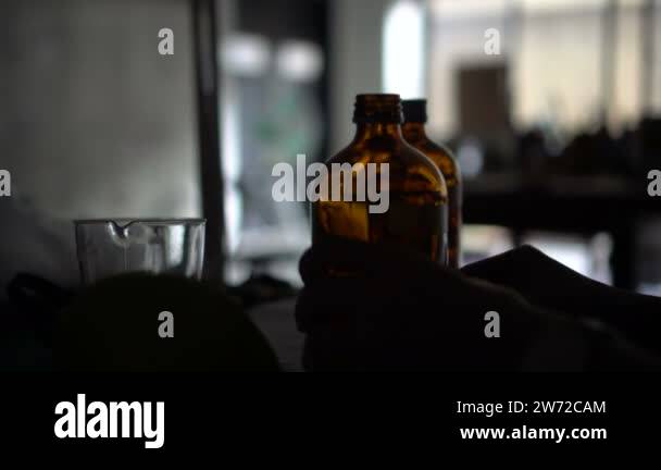 Cyanotype process of mixing chemicals in dark room for print making art ...