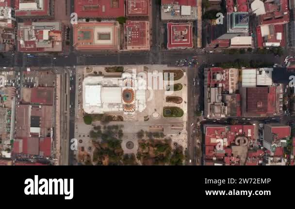Aerial birds eye overhead top down diagonal panning view of buildings ...