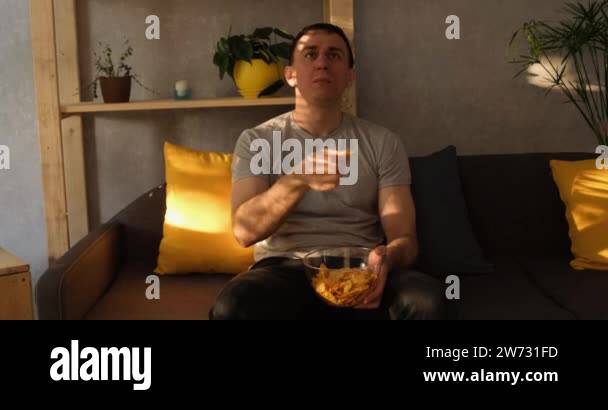 Man eating crisps television Stock Videos & Footage - HD and 4K Video ...