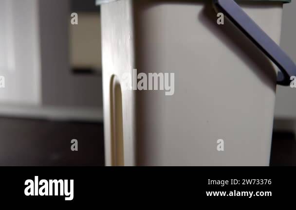 Shooting in motion, close-up, the hostess wrung out a rag in a bucket ...