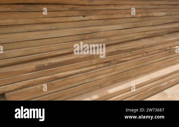 Piles of wooden planks at a sawmill, formwork. Warehouse for sawing ...