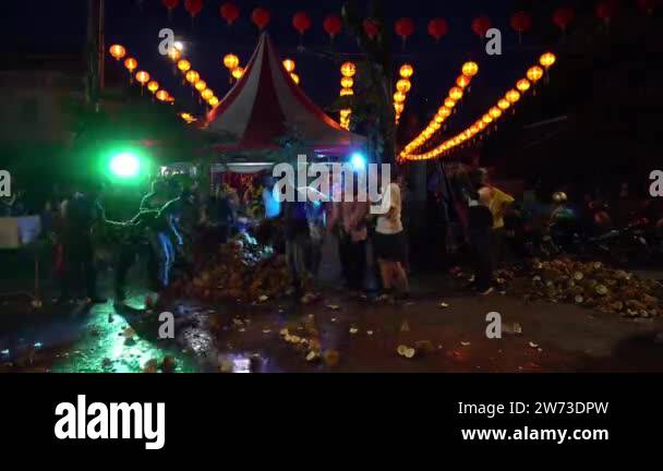 Coconut smash in front of Goddess of Mercy temple during Thaipusam ...