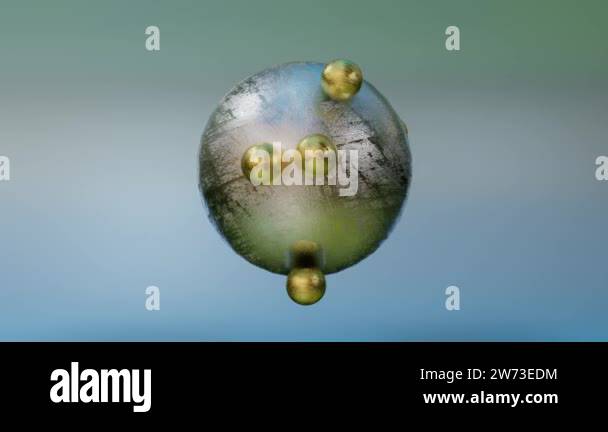 golden spheres roll over the surface of a large silvery sphere. looped ...