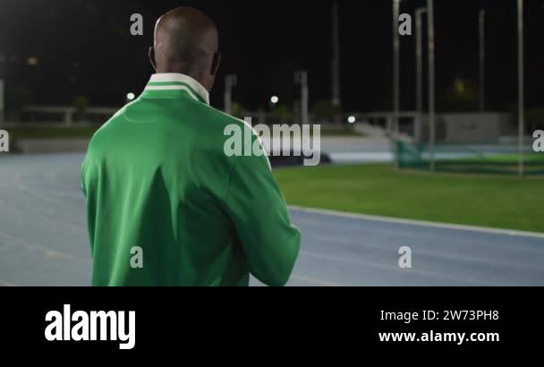 African american male coach clapping watching disabled male athlete ...