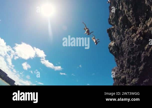 Beautiful Young Women Cliff Jump in Bikinis. Luxury Resort Vacation ...