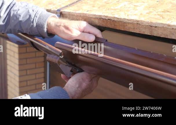 Installation of a gutter. Docking of the metal chute. Installation of a ...